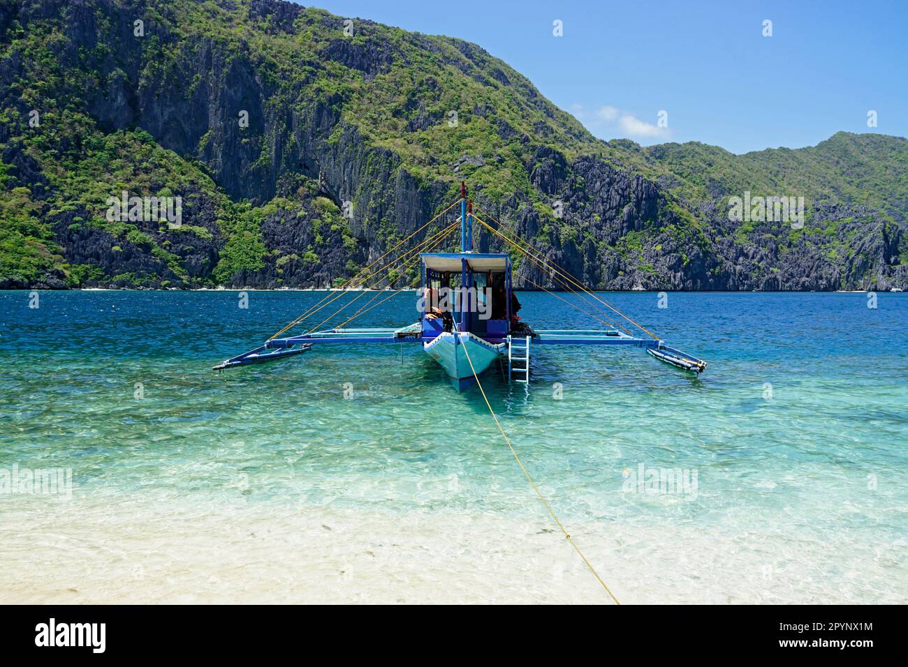 wooden traditional outrigger boats on palawan island at the philippines ...