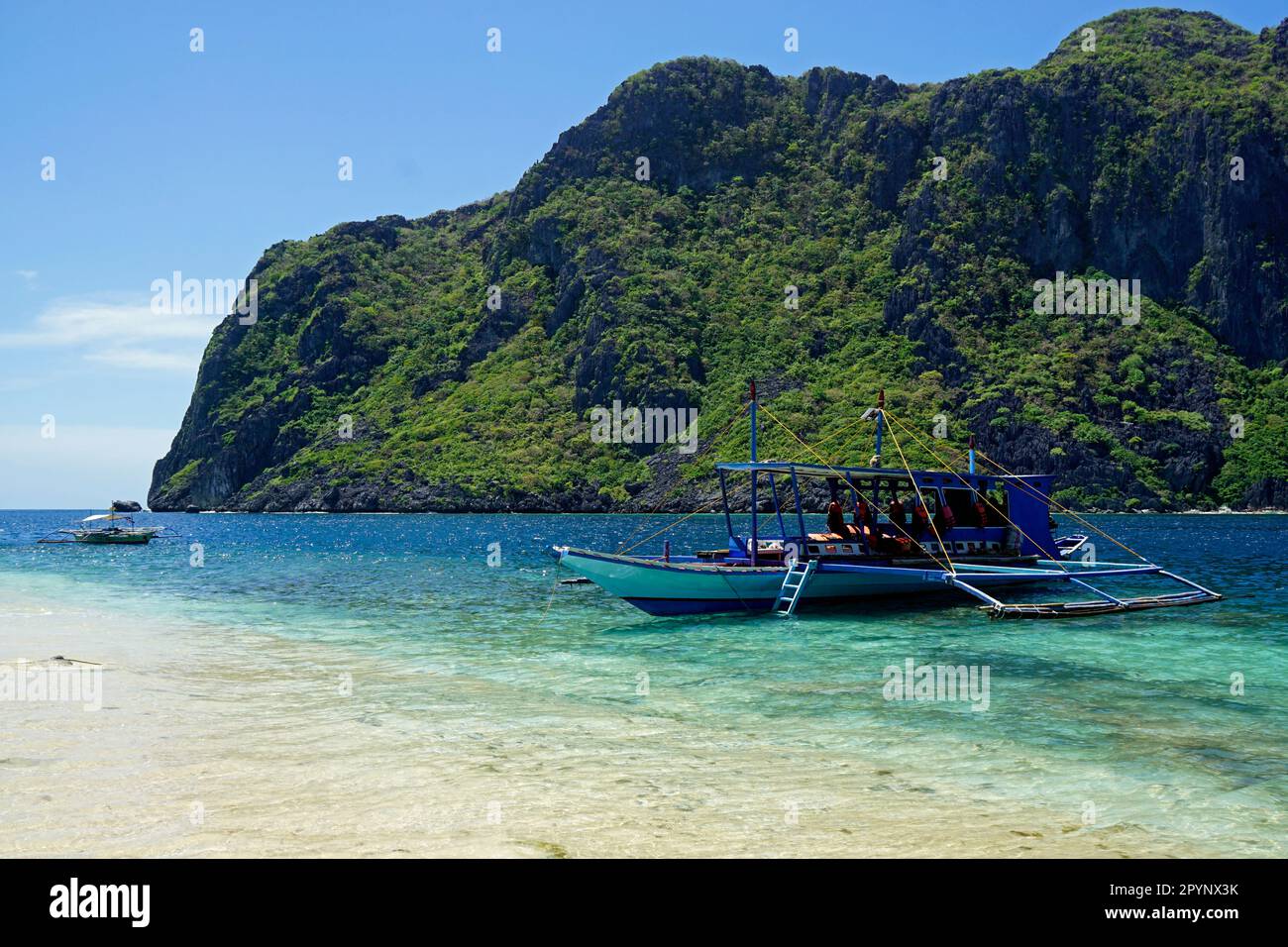 wooden traditional outrigger boats on palawan island at the philippines ...