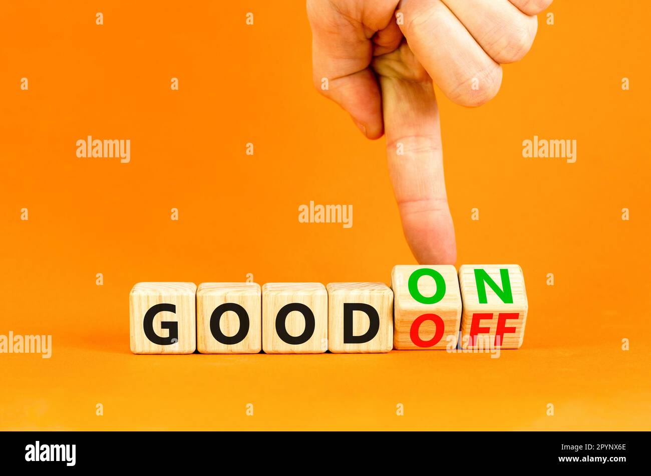Good on or off symbol. Businessman turns wooden cubes and changes word ...