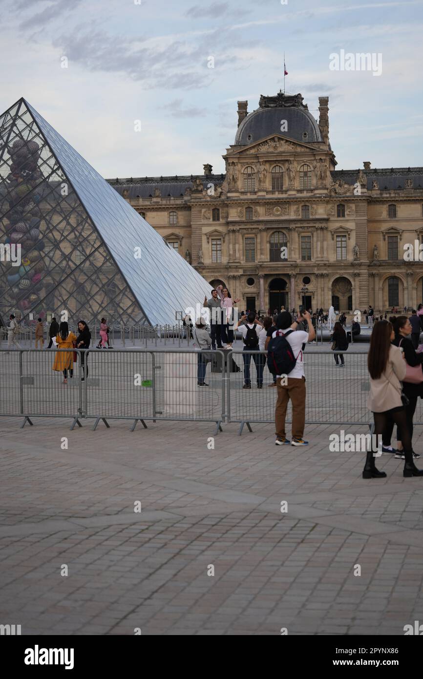 A group of tourists visiting the Louvre Museum in Paris Stock Photo - Alamy