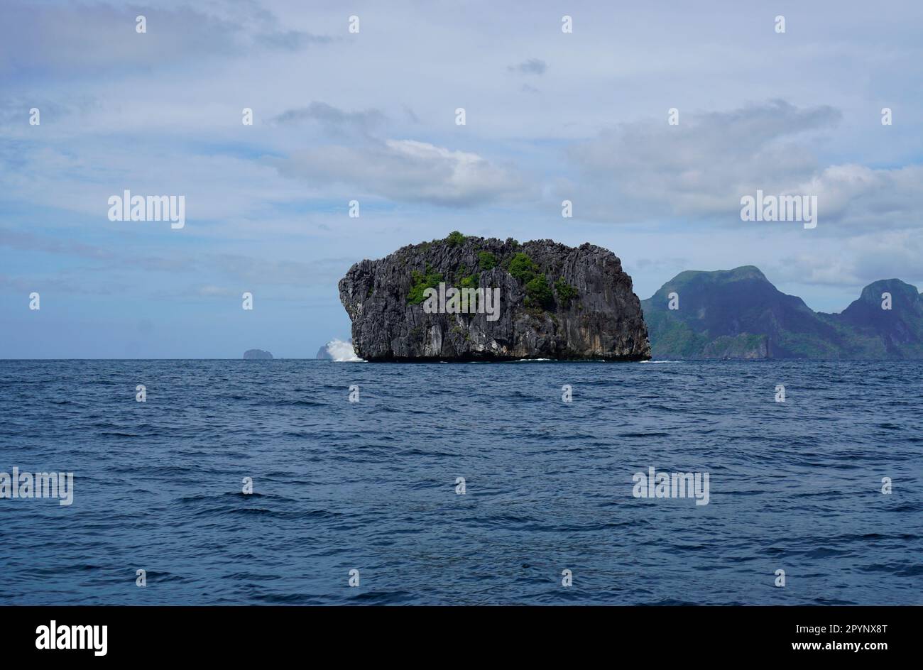 massive limestone rocks in the blue sea at the el nido archipelago ...