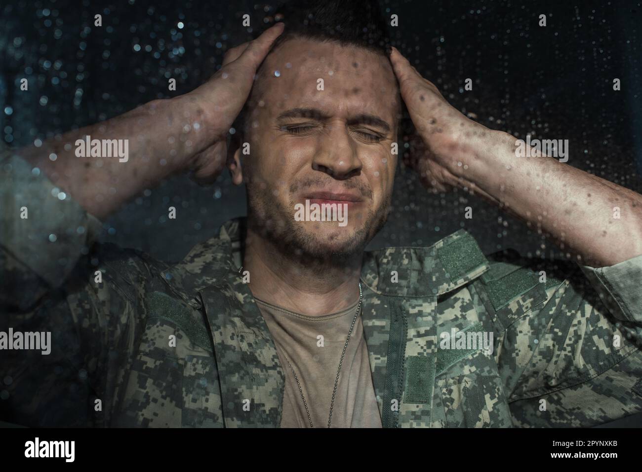 anxious serviceman in military uniform suffering from post traumatic ...