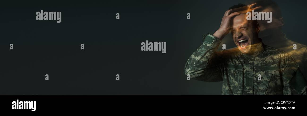 motion blur of soldier in camouflage uniform screaming while suffering ...