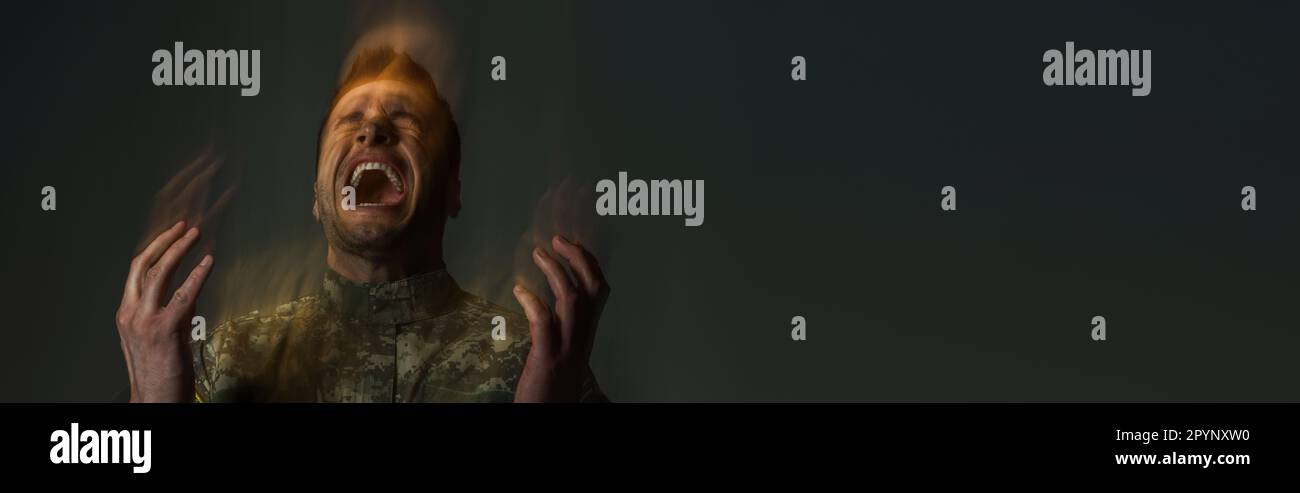 Long exposure of soldier in military uniform screaming while suffering ...