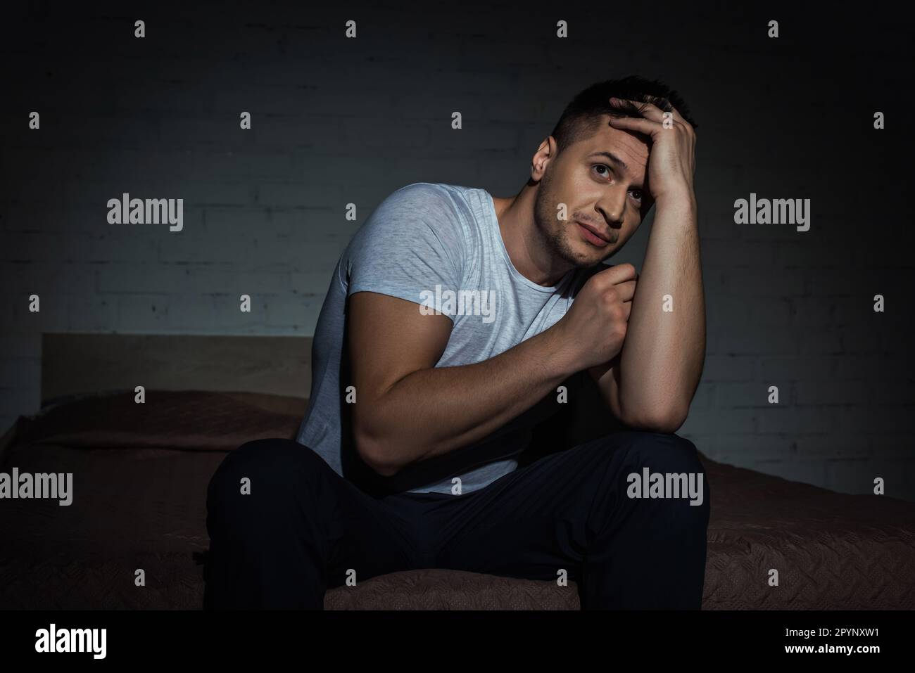 scared man having insomnia and struggling from post traumatic stress ...