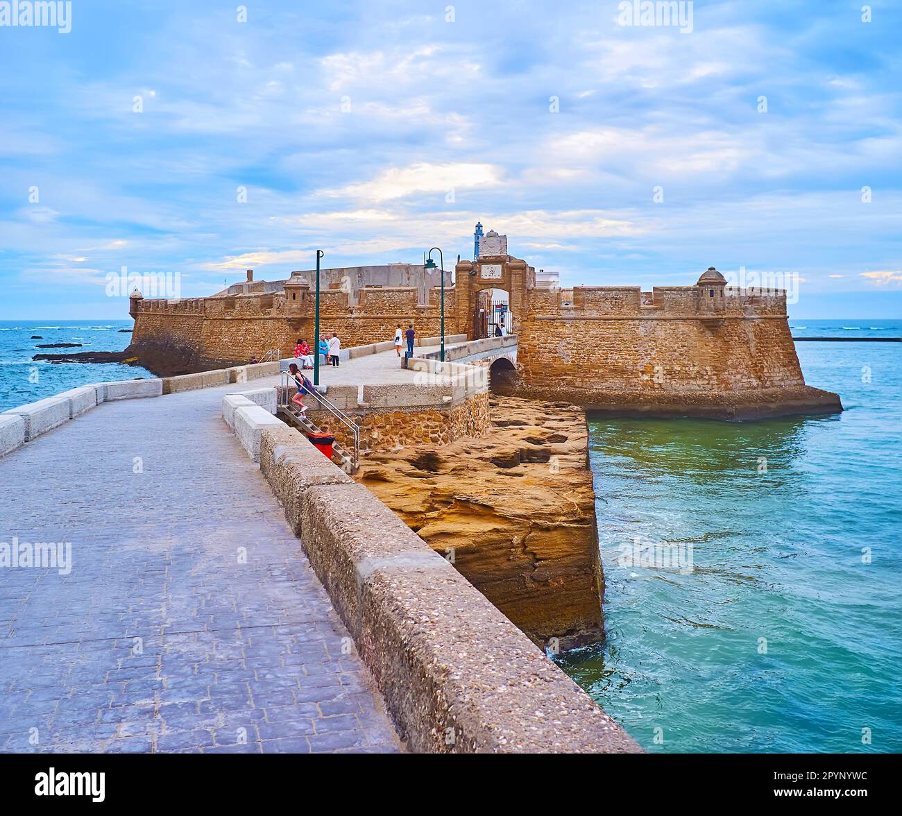 The stone levee, leading to the medieval San Sebastian Castle with ...