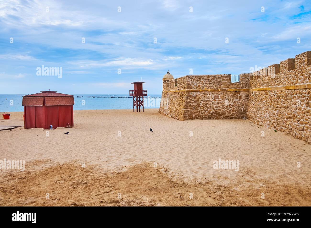 The stone rampart of San Sebastian Castle on the sand La Caleta beach, Cadiz, Spain Stock Photo ...