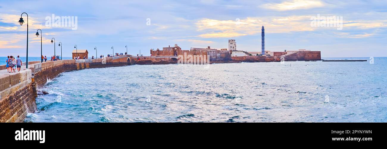 Panorama of medieval stone San Sebastian Castle from its levee, stretching from the mainland to ...