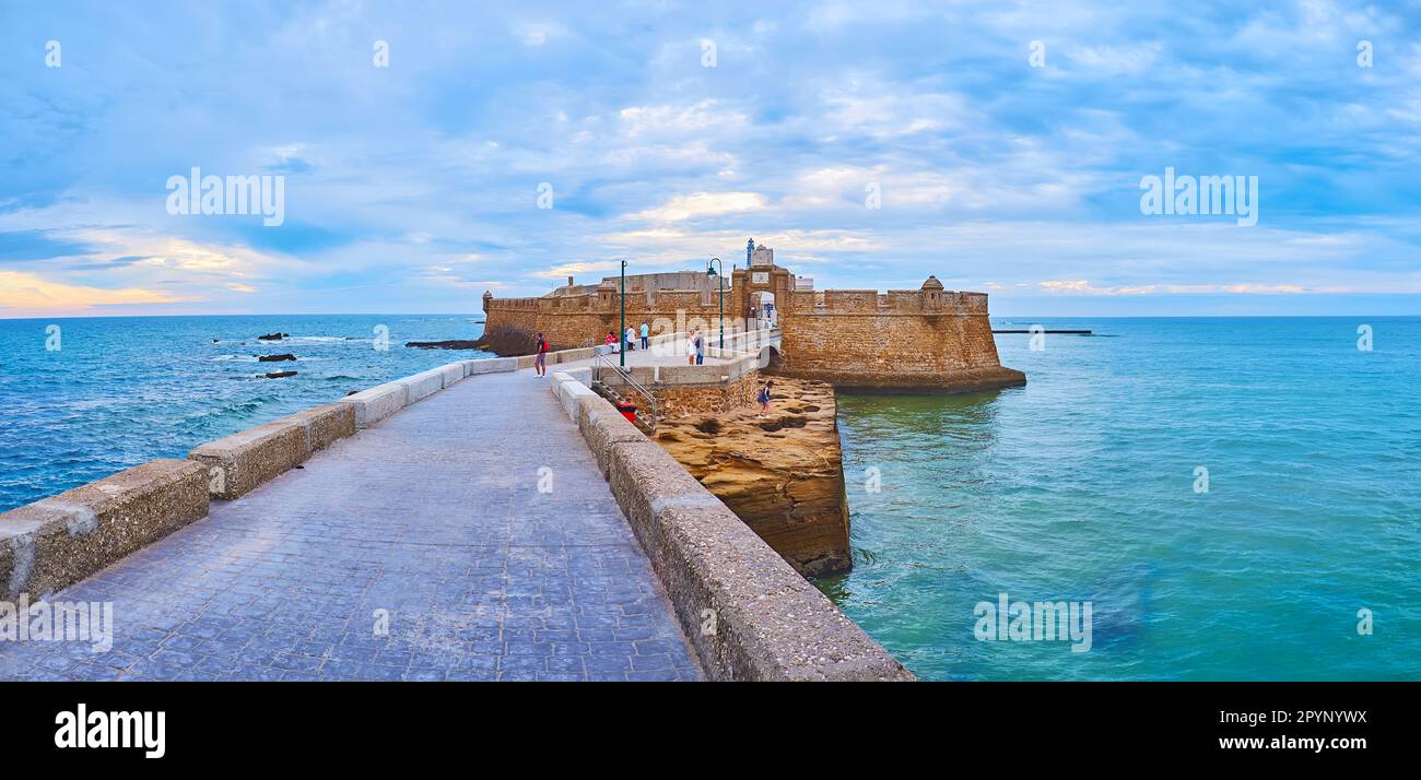 Panoramic view of the medieval San Sebastian Castle, stone levee and blue waters of Atlantic ...