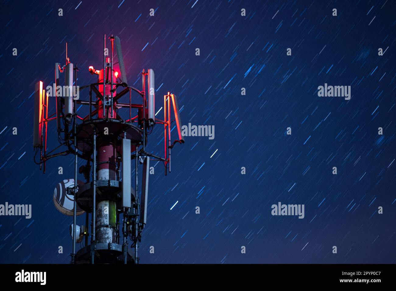Telecommunication towers with 5G cellular network antennas on nature ...