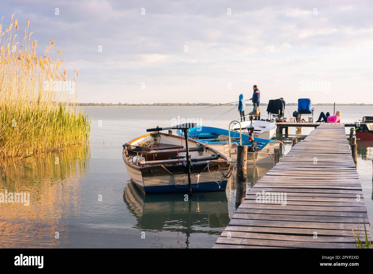Family vacation at Lake Balaton, Fishing together, Boats, Setting sun ...
