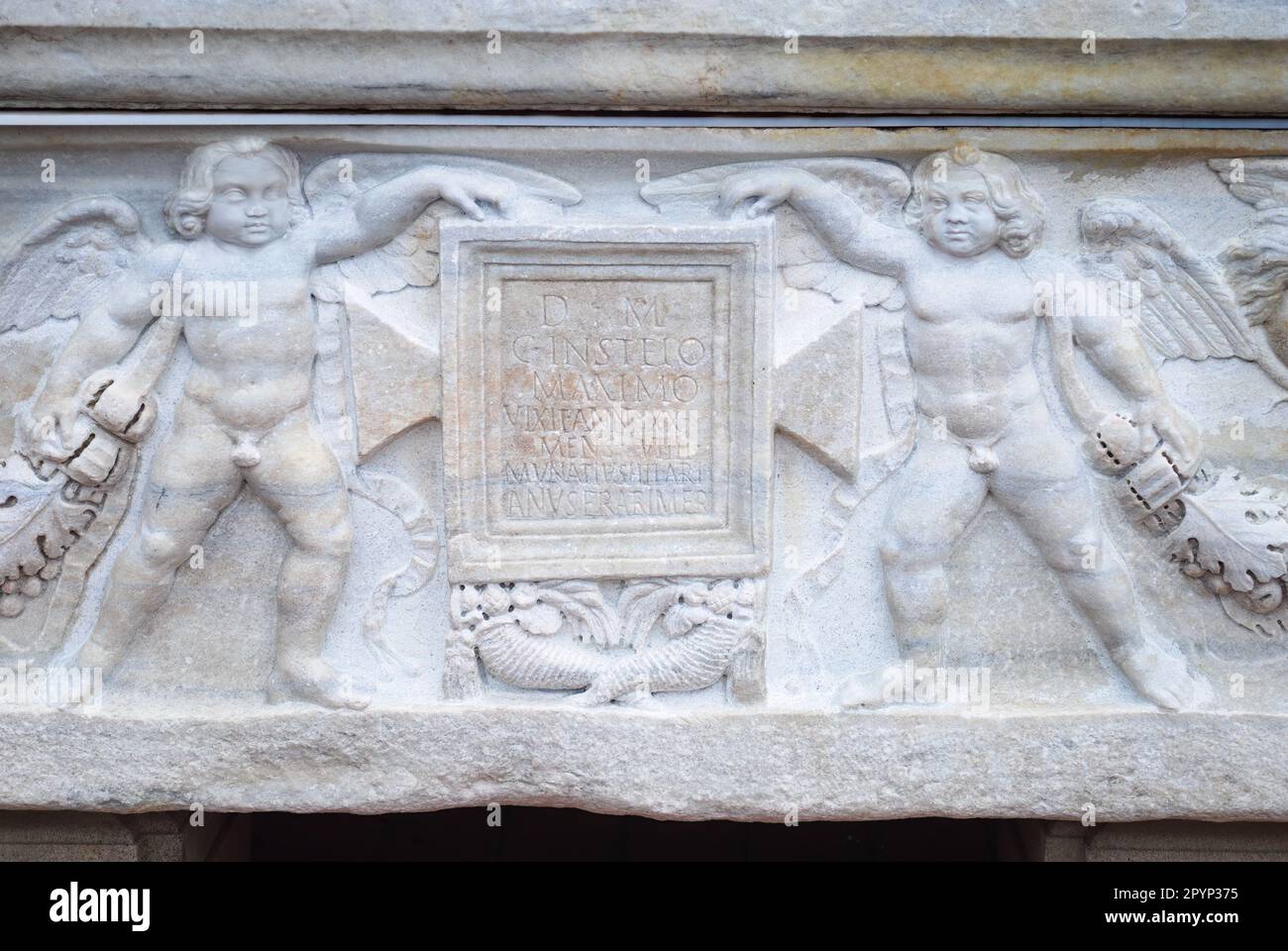 A wall featuring multiple statues with various in a decorative ...