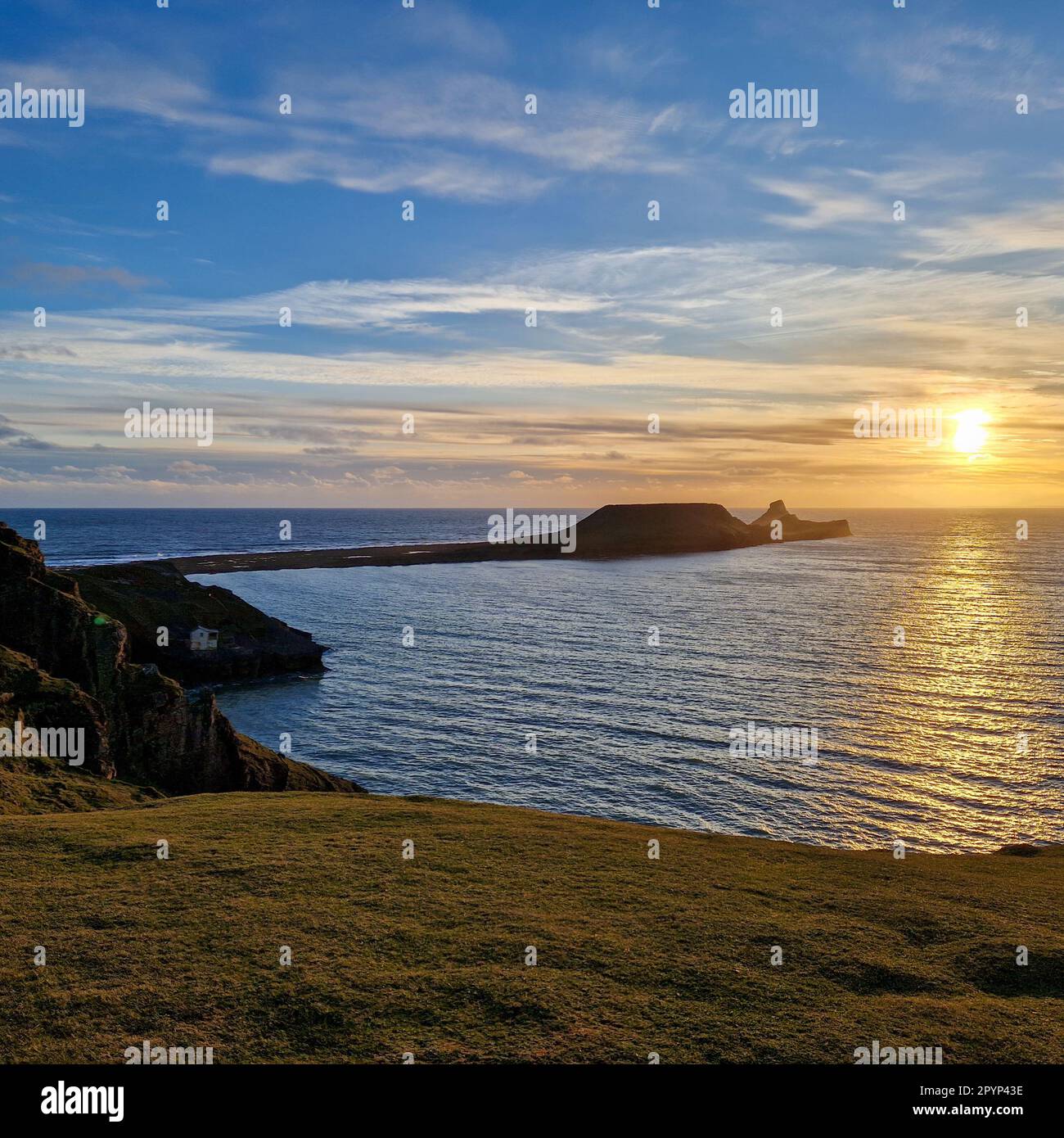 In this breathtaking photograph, the sun sets behind the iconic Worm's ...