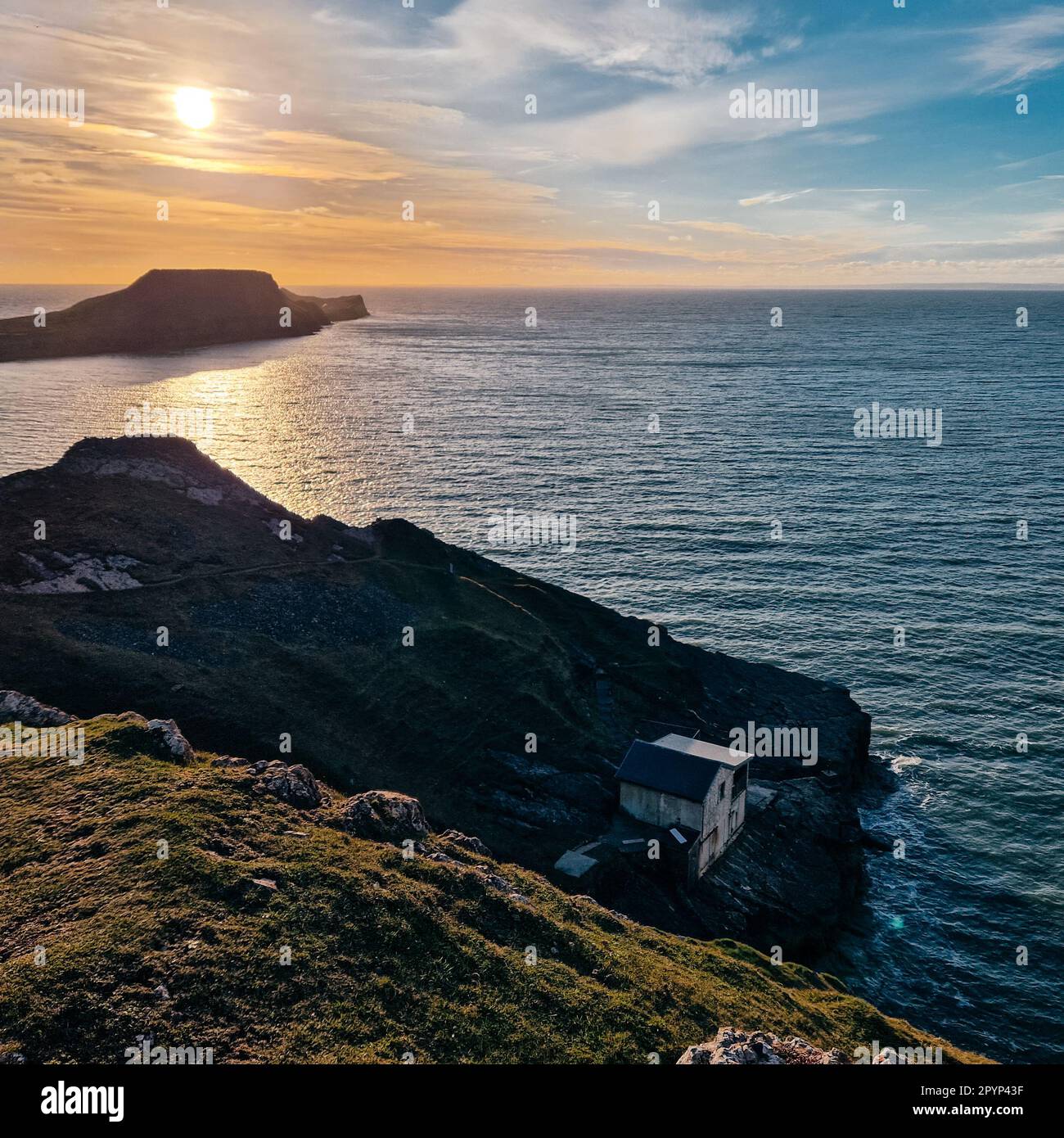 In this breathtaking photograph, the sun sets behind the iconic Worm's ...