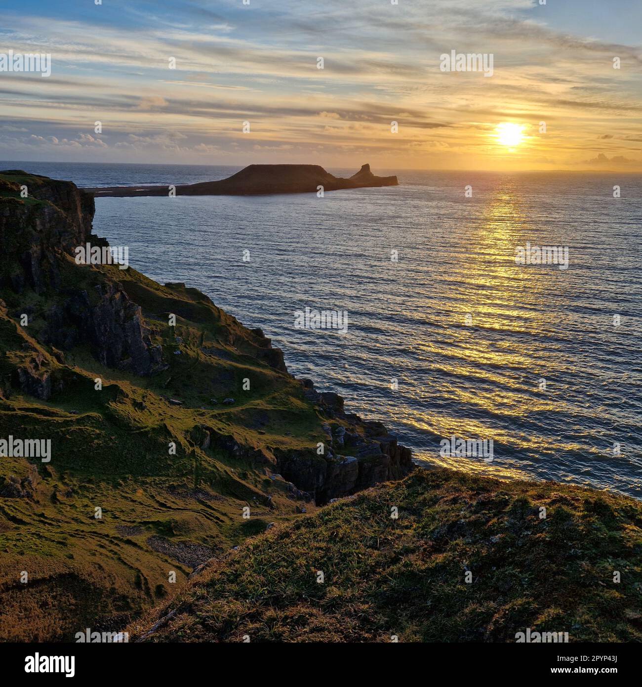 In this breathtaking photograph, the sun sets behind the iconic Worm's ...