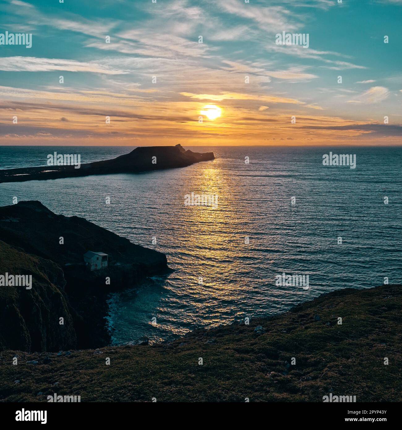 In this breathtaking photograph, the sun sets behind the iconic Worm's ...