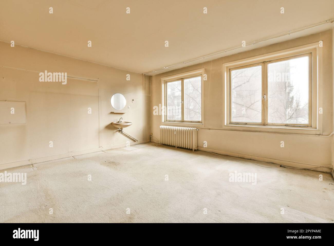 an empty room with white walls and no one person in the room looking ...