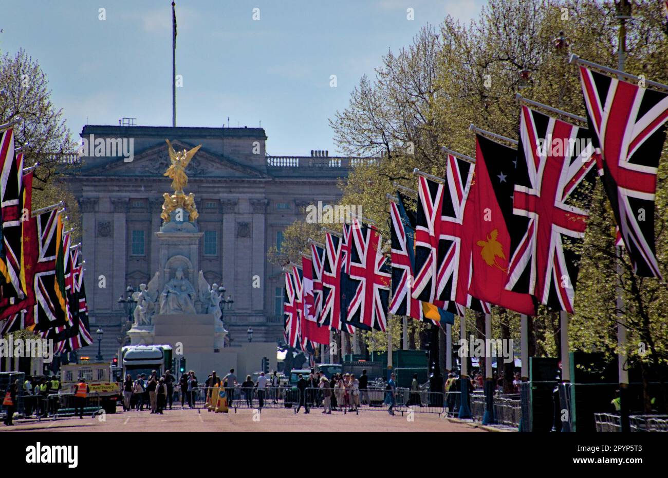 The view down The Mall towards Buckingham Palace in London, UK. The flags are flying in ...