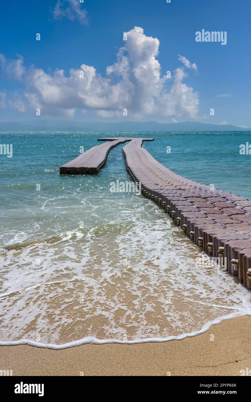 Plastic pontoon walkway floating in the water sea on tropical beach in ...