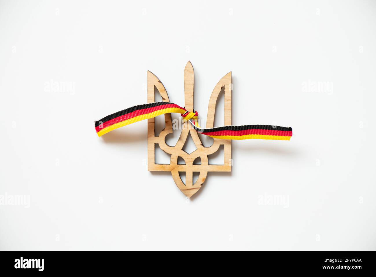 Wooden trident of Ukraine and the ribbon of the flag of Germany tied to ...