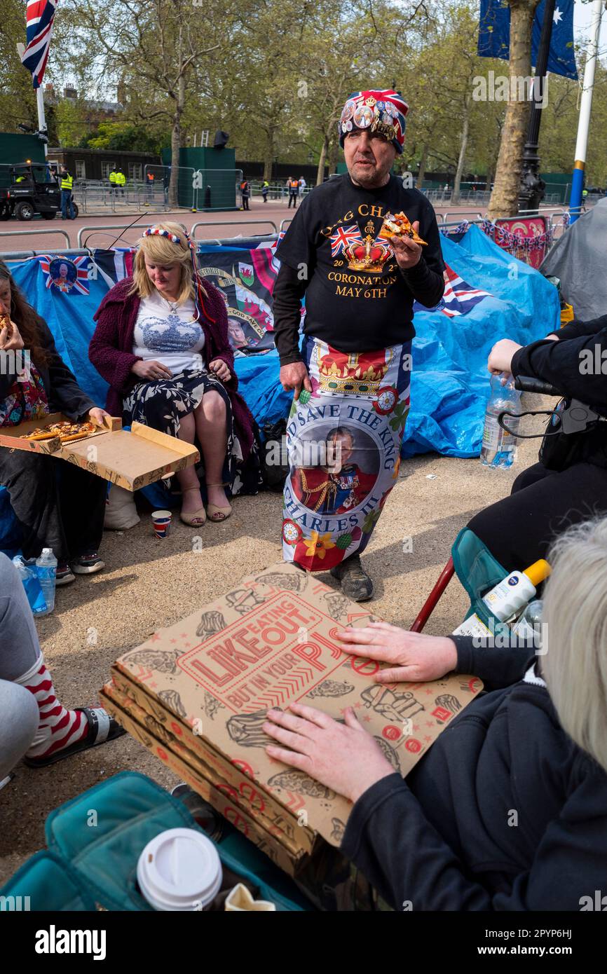 London, UK. 4 May 2023. Royal superfans eating pizza after arriving early on The Mall and ...
