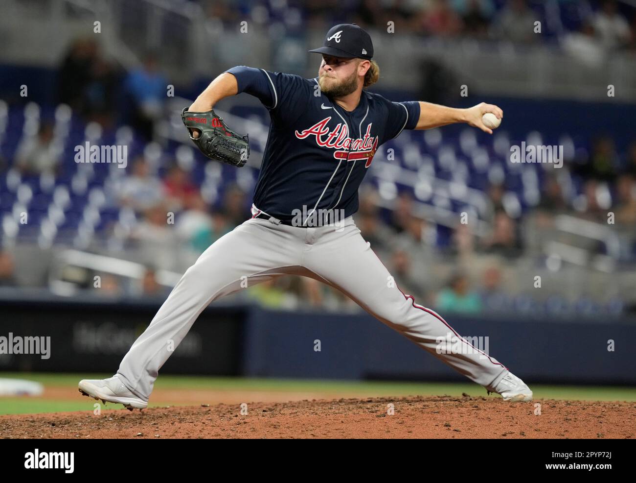Atlanta Braves relief pitcher A.J. Minter (33) aims a pitch in the ...