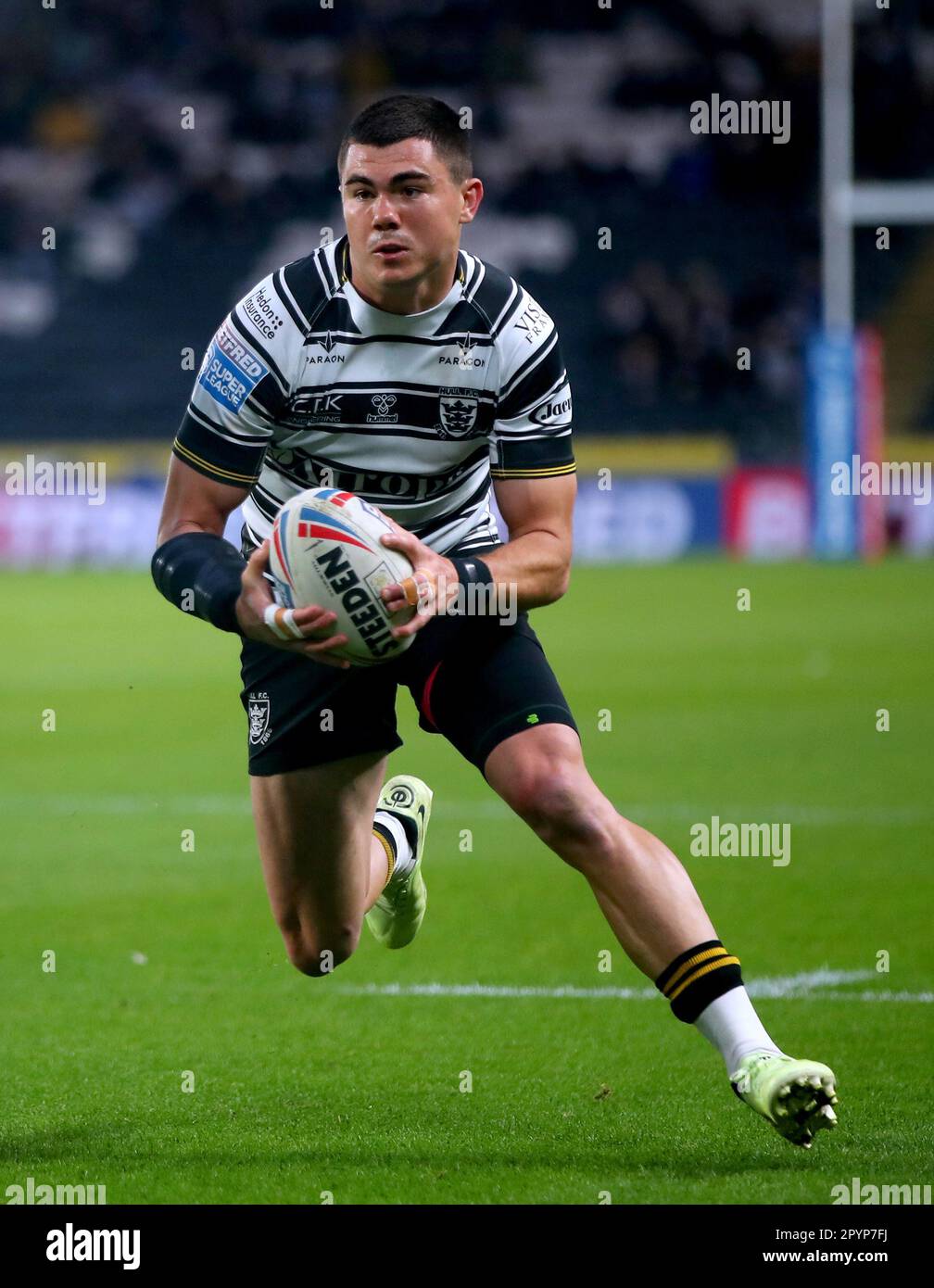 Hull FC's Jake Clifford on his way to score his side's second try ...