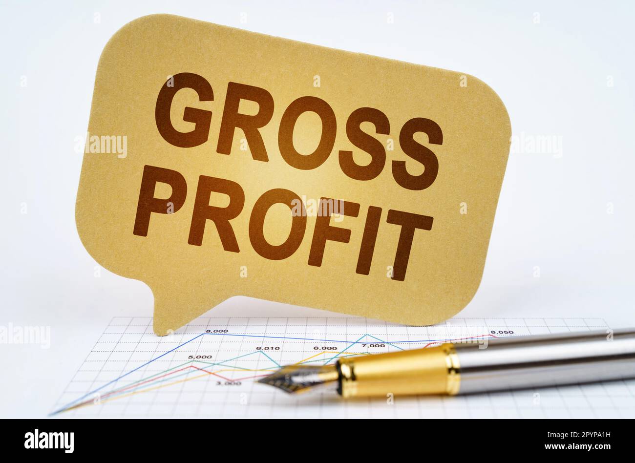 Business concept. On the business diagram is a pen and a sign with the ...