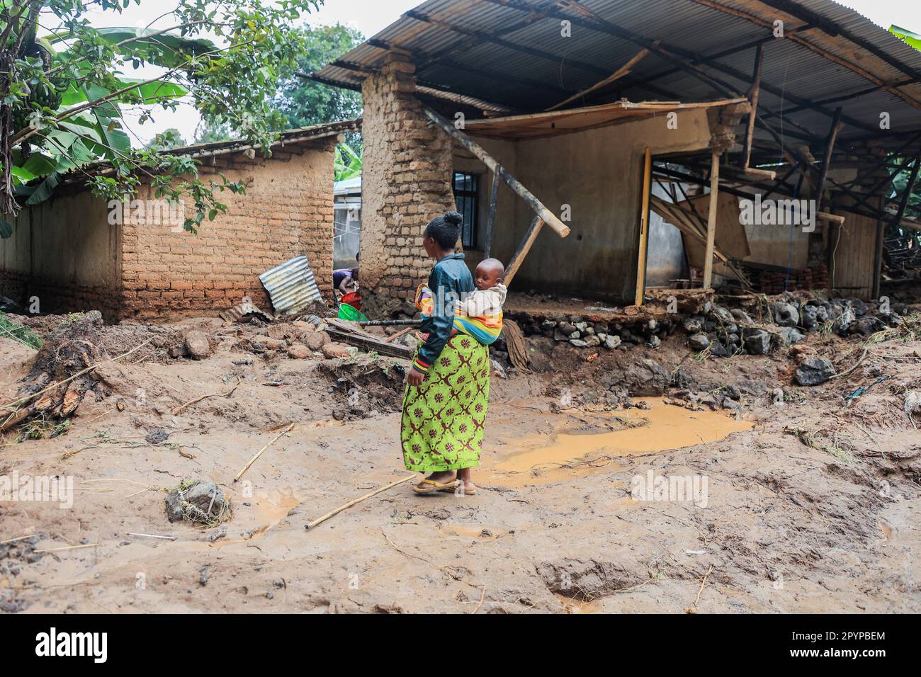 Rubavu, Rwanda. 4th May, 2023. A woman is seen with her child in front ...