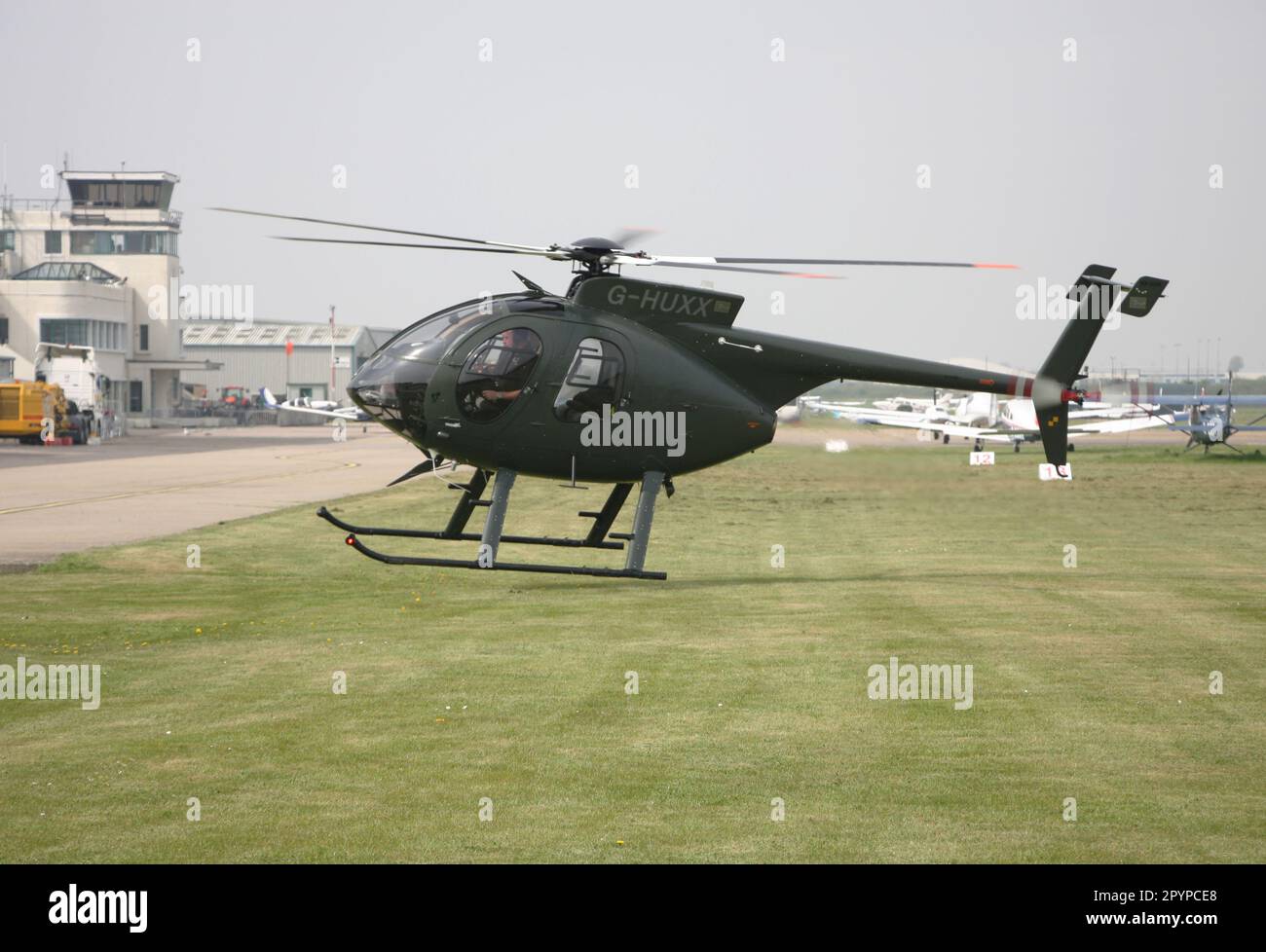 An MD Helicopters 369E departing Brighton City Airport West Sussex ...