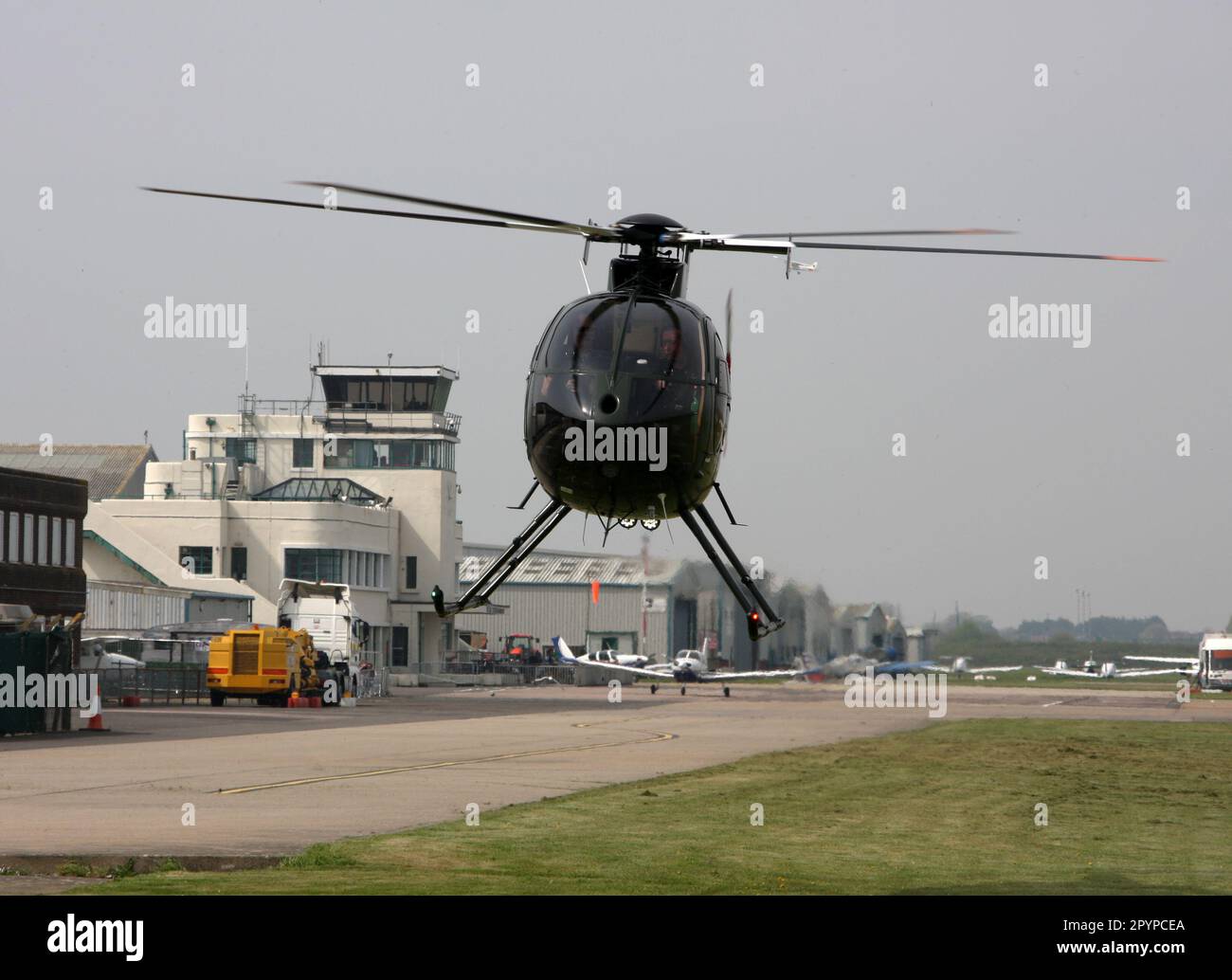 An MD Helicopters 369E departing Brighton City Airport West Sussex ...