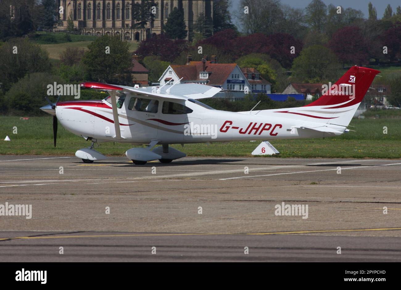A Cessna 182T Skylane in front of Lancing College at Brighton City ...