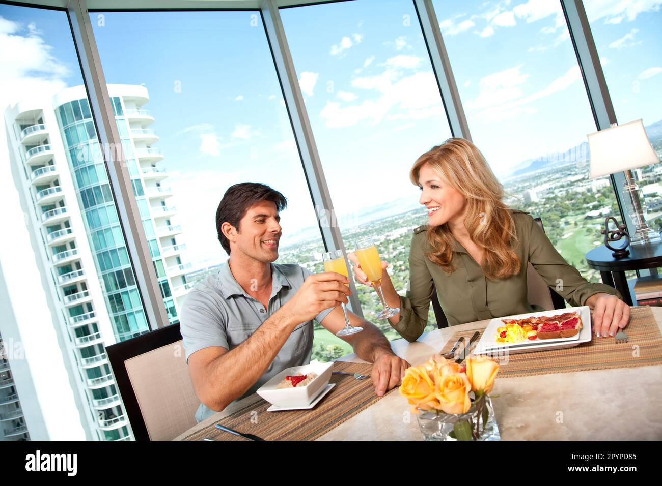Couple Having Brunch In High Rise Condo Stock Photo - Alamy