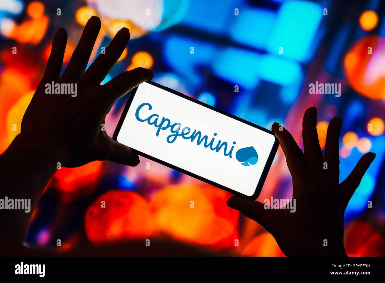 In this photo illustration, the Capgemini logo is displayed on a ...