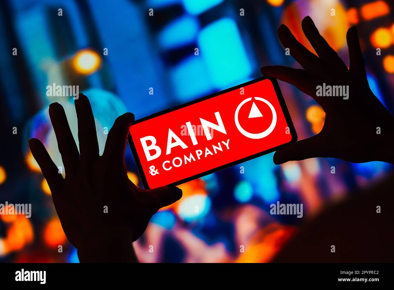 In this photo illustration, the Bain and Company logo is displayed on a ...