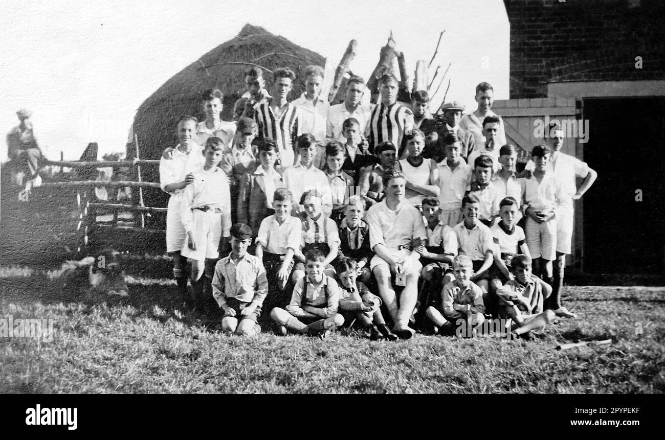 A group of young men and boys in a rural setting, c1928. From a unique ...