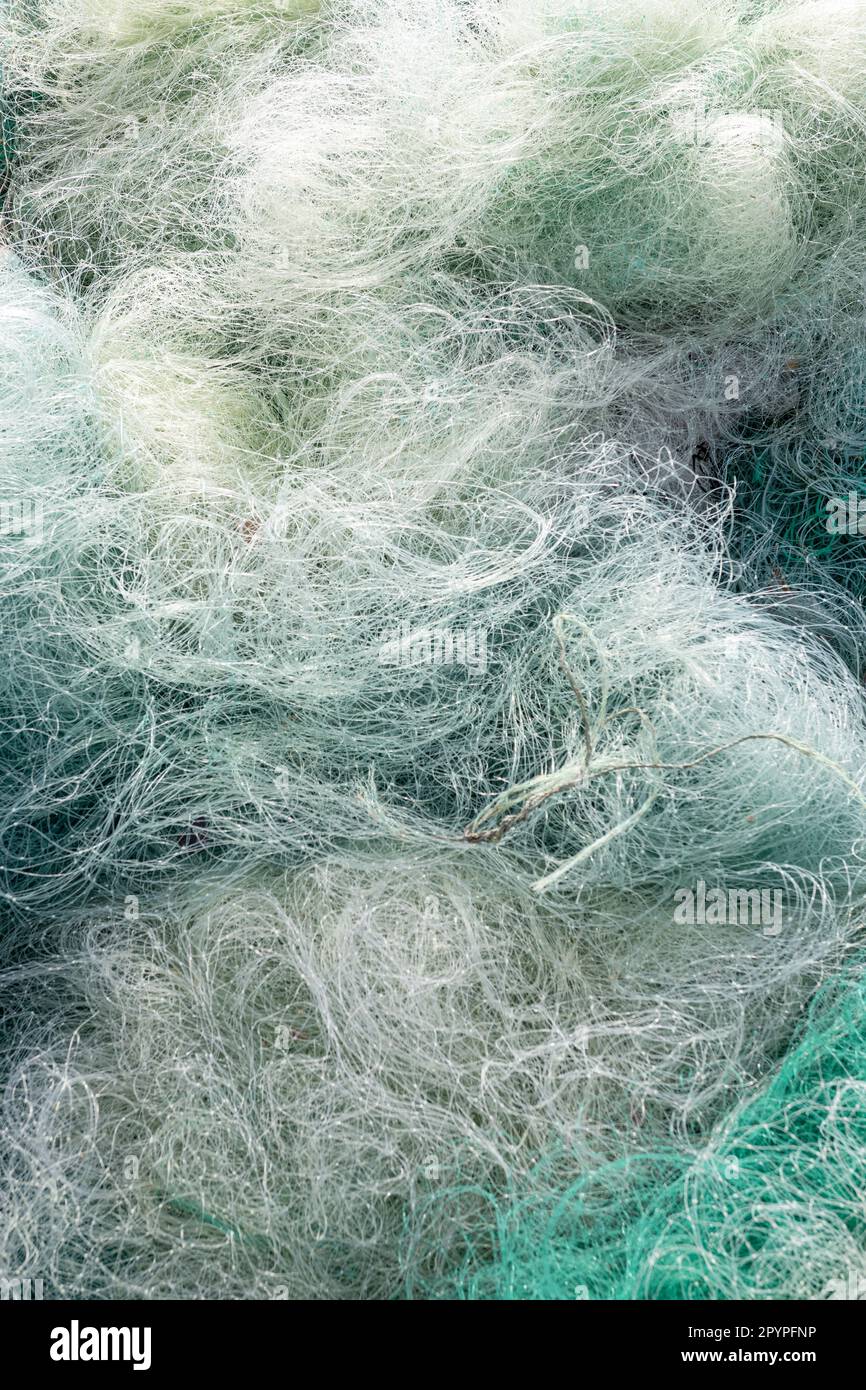 Background of Used fishing net. Fishing industry waste Stock Photo - Alamy