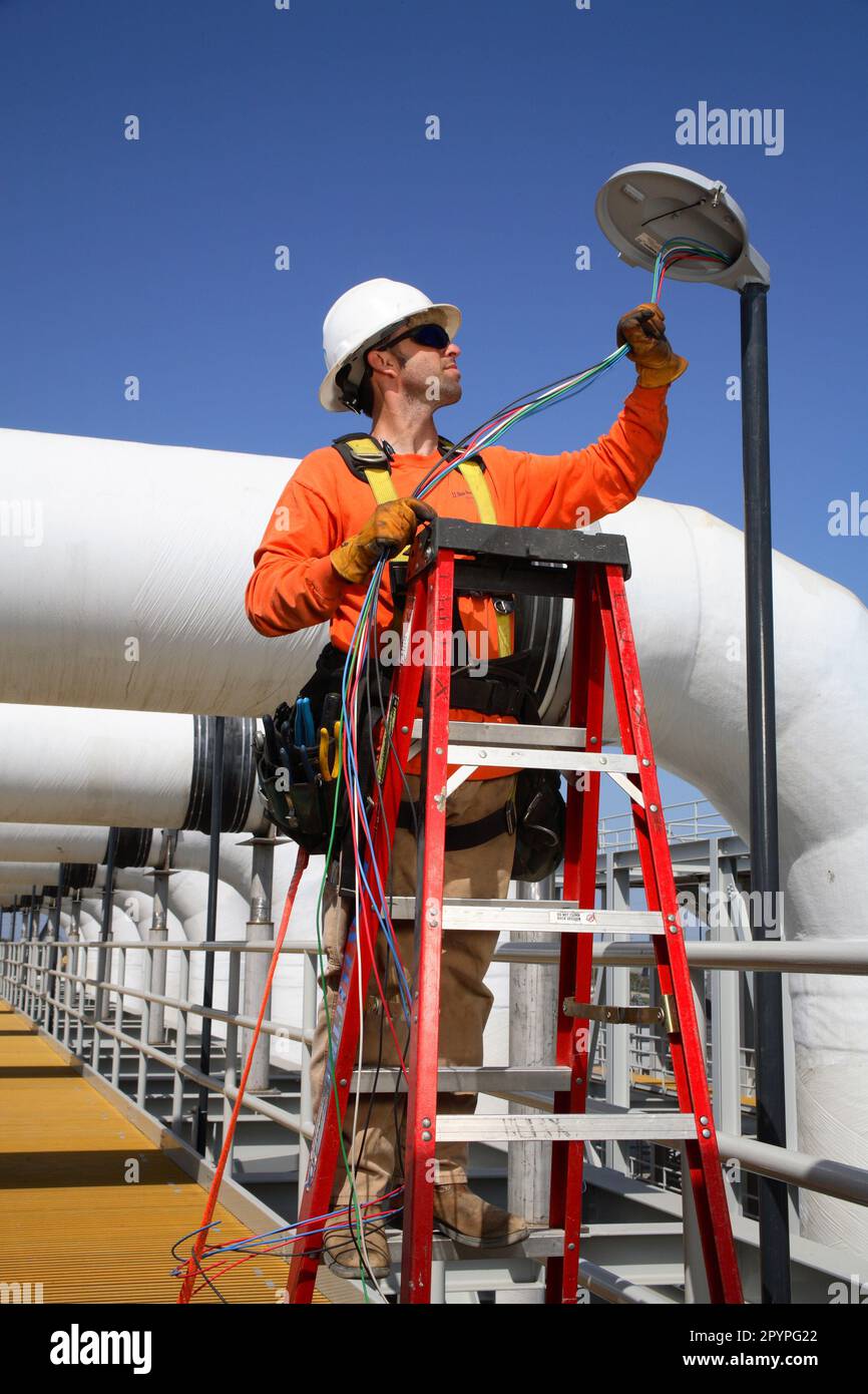Construction Man Working On Electrical Lighting Stock Photo - Alamy