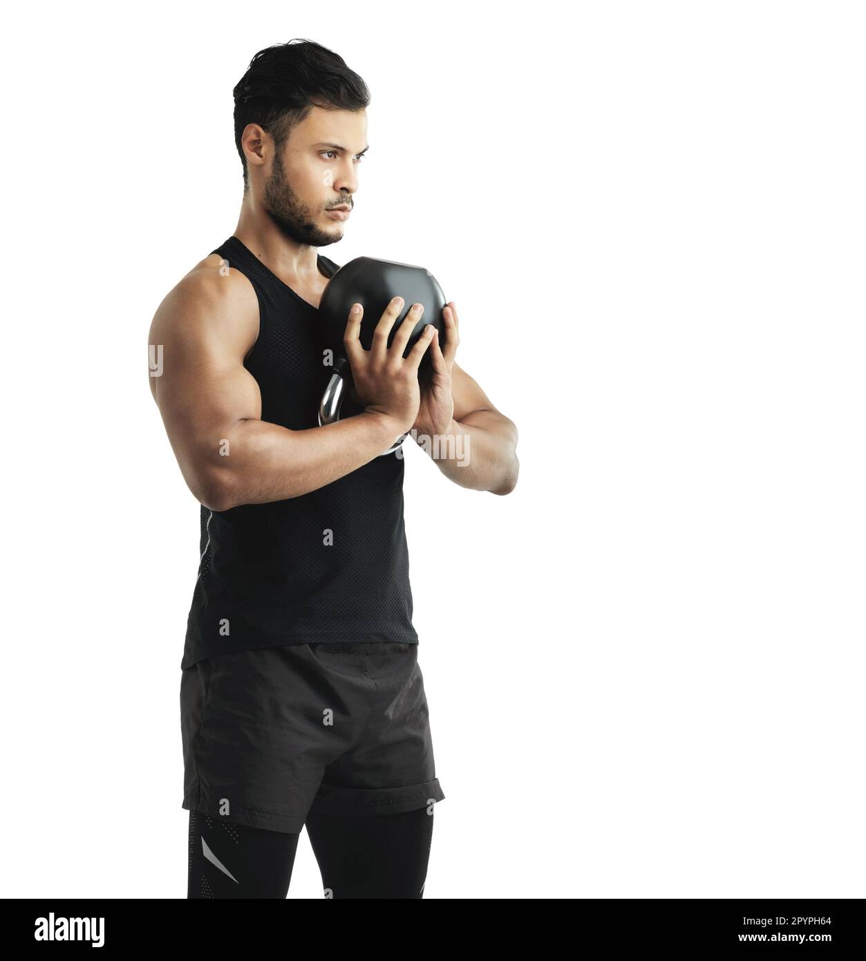 Staying in top form. Studio shot of a fit young man working out with a ...