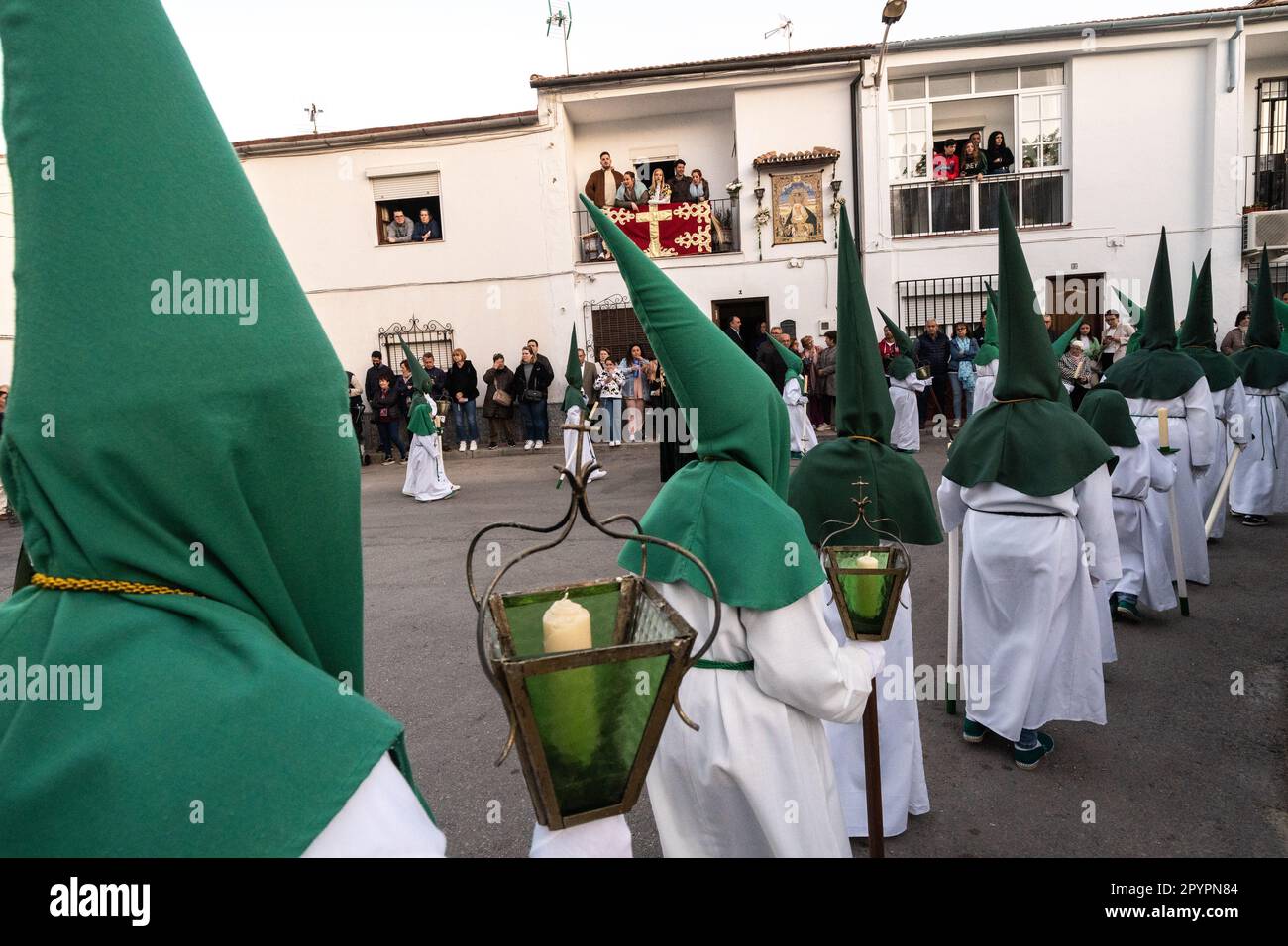 Cofradias wearing green cone shaped hats lead a procession during Holy ...