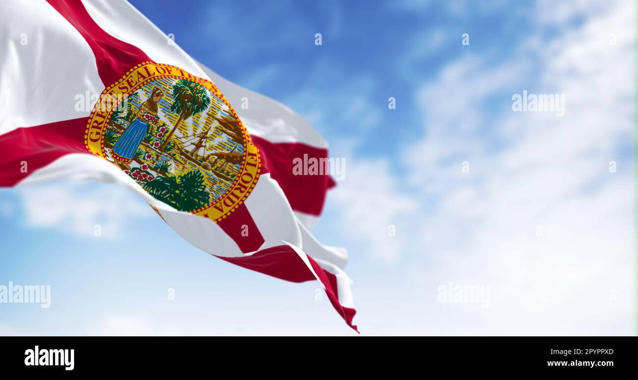 Close-up view of the Florida state flag waving in the wind on a clear ...