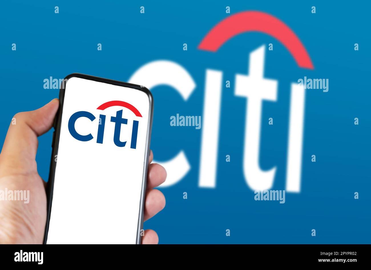 New York, US, March 2023: Hand holding a phone with Citi logo on the ...