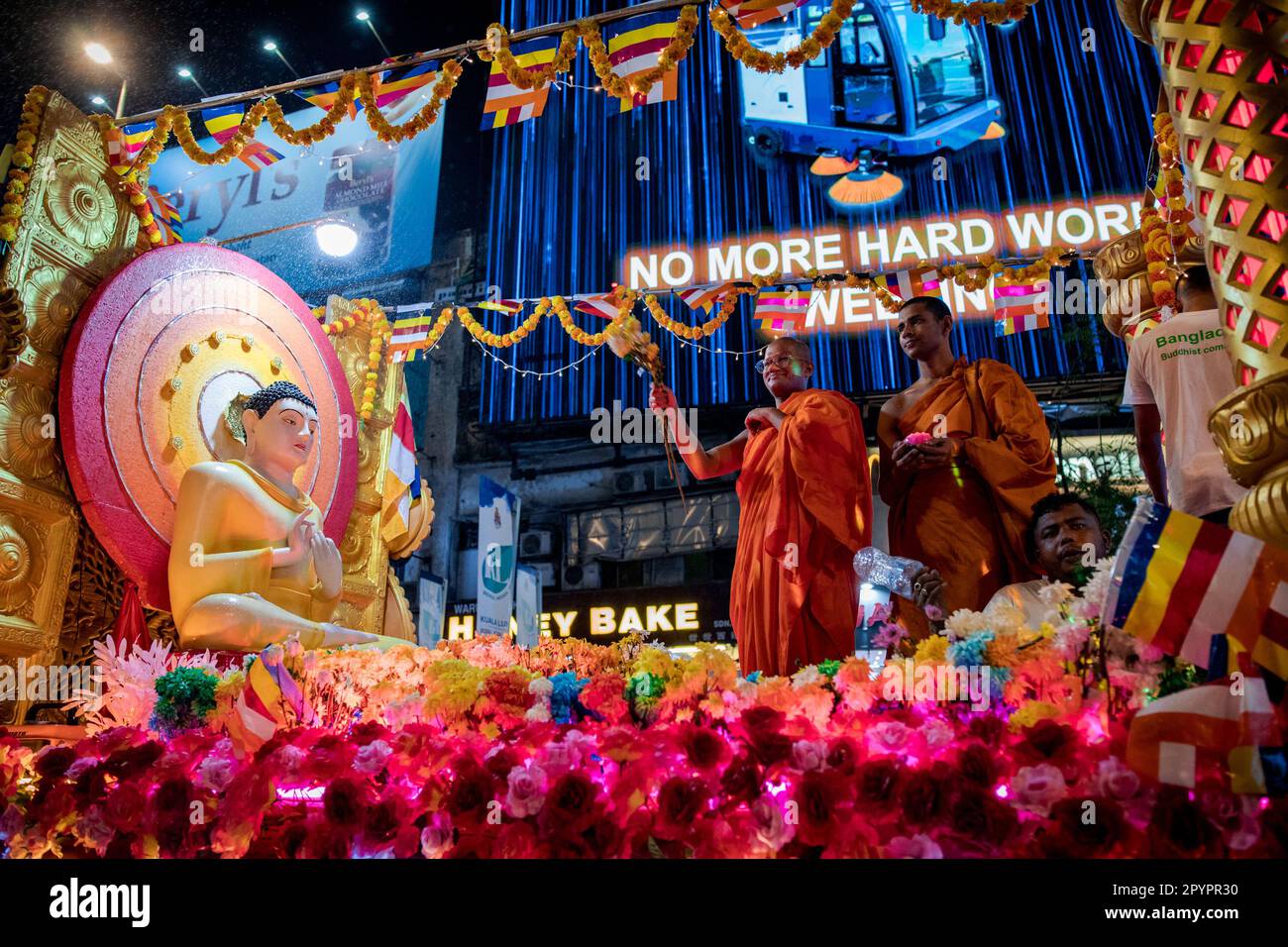 Two Buddhist monks are seen during a float procession in conjunction ...