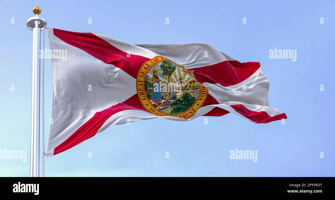 Close-up view of the Florida state flag waving in the wind on a clear ...