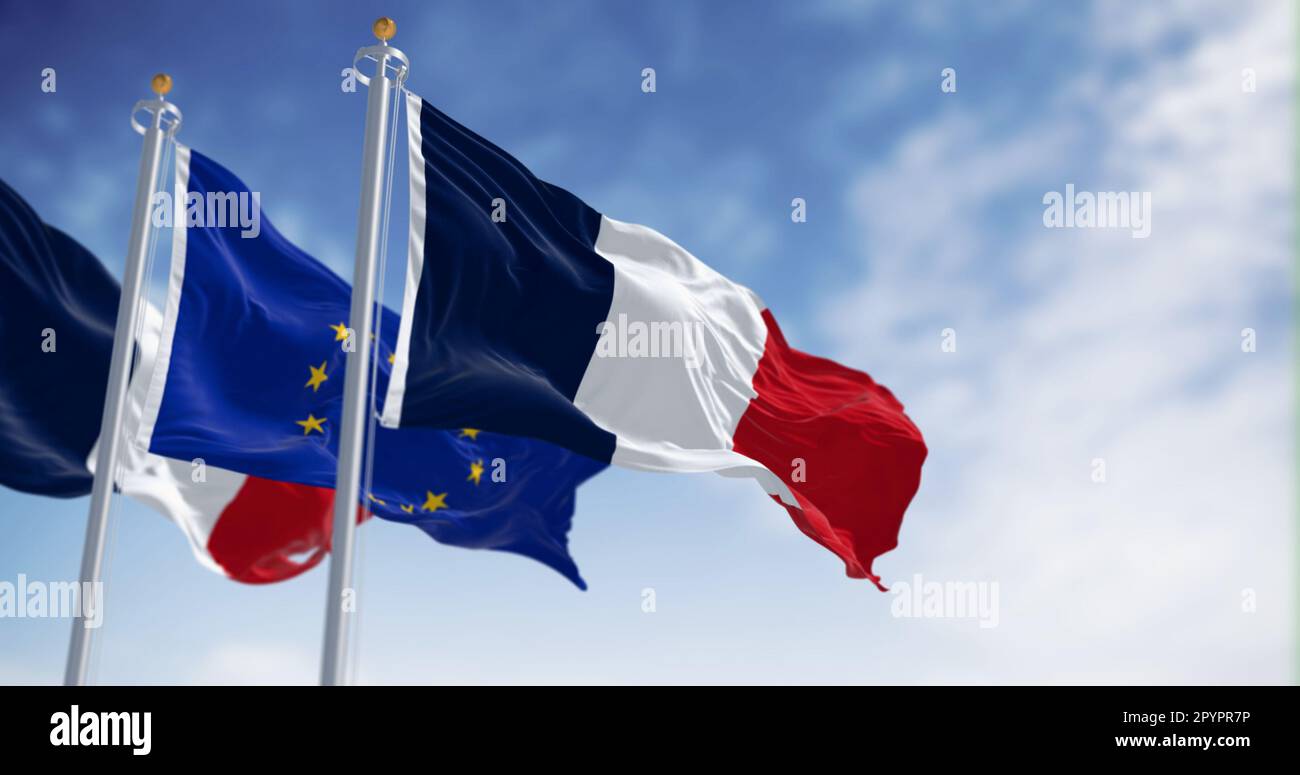 The flags of France and the European Union waving together on a clear ...