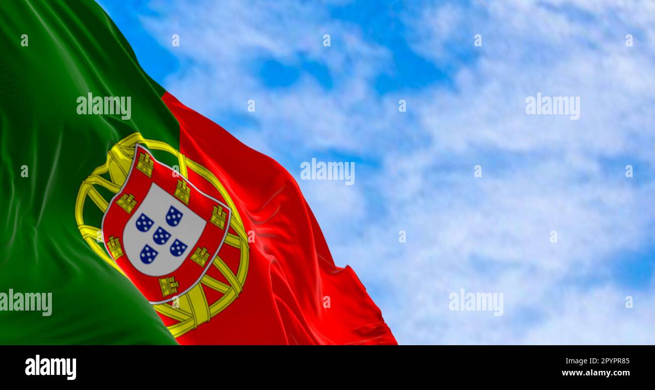 Portugal national flag waving in the wind on a clear day. Portuguese ...