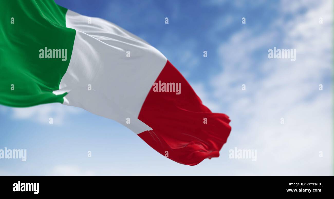 Italy national flag waving in the wind on a clear day. Three vertical ...