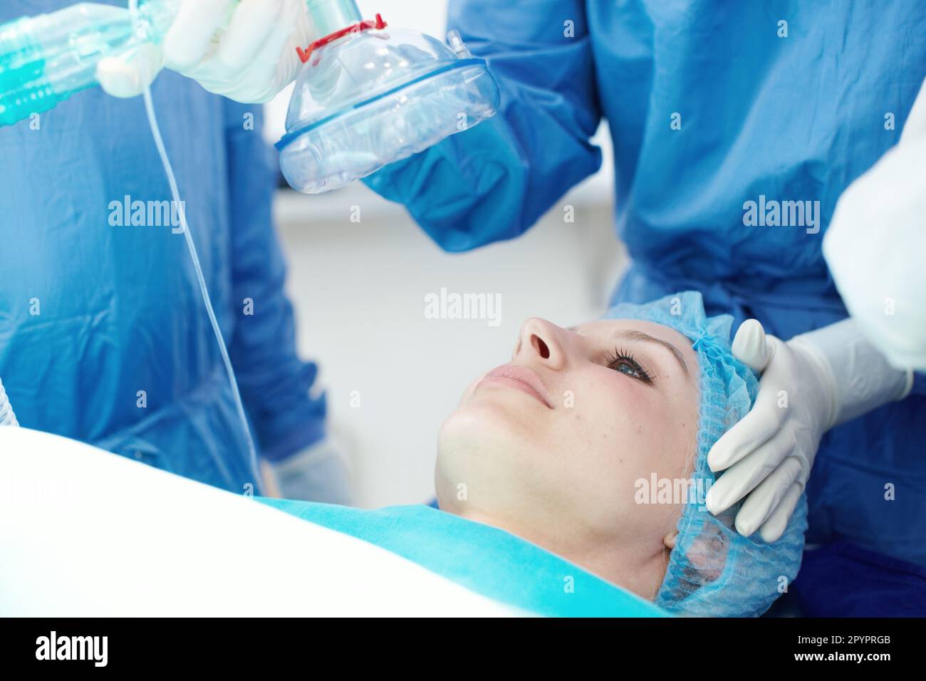 Putting you to sleep. A female patient going under general anaesthetic ...