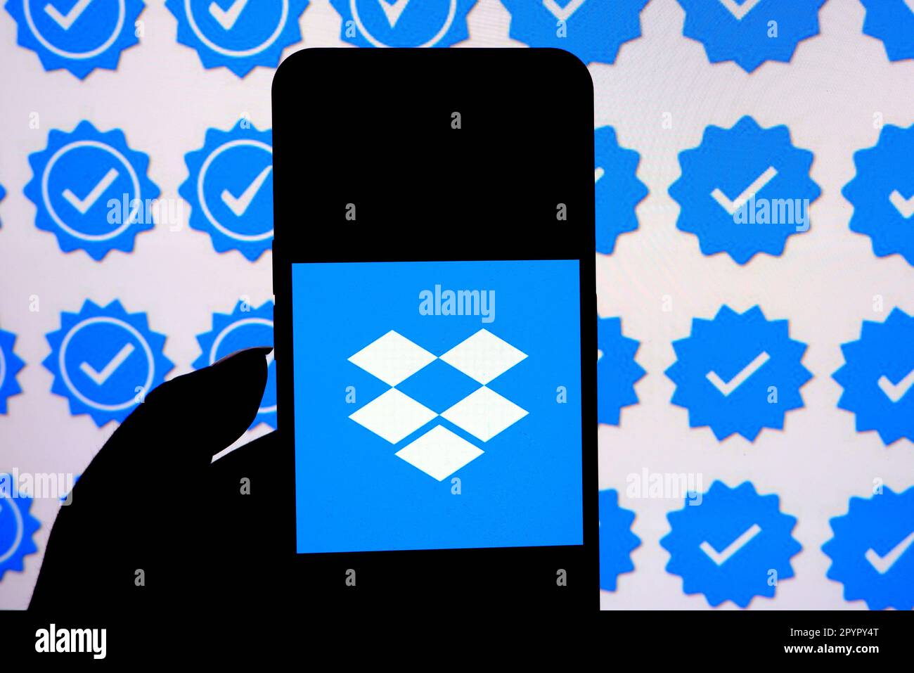 In this photo illustration, a Dropbox logo is displayed on a smartphone ...