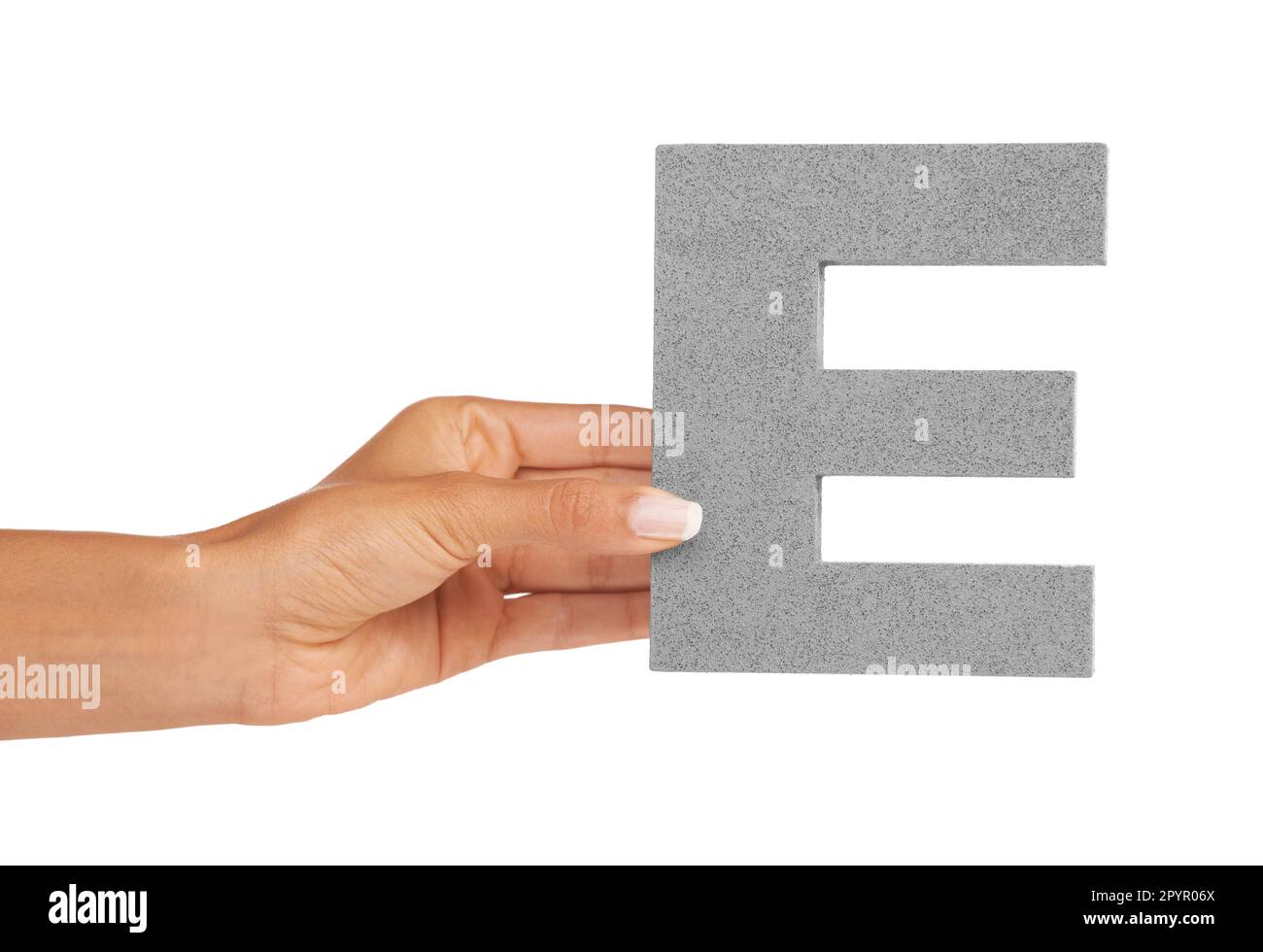 Learning the alphabet E. A young woman holding a capital letter E ...